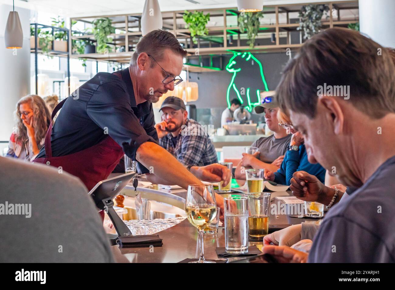 Denver, Colorado - Workers at bar dough, an airport restaurant and bar ...