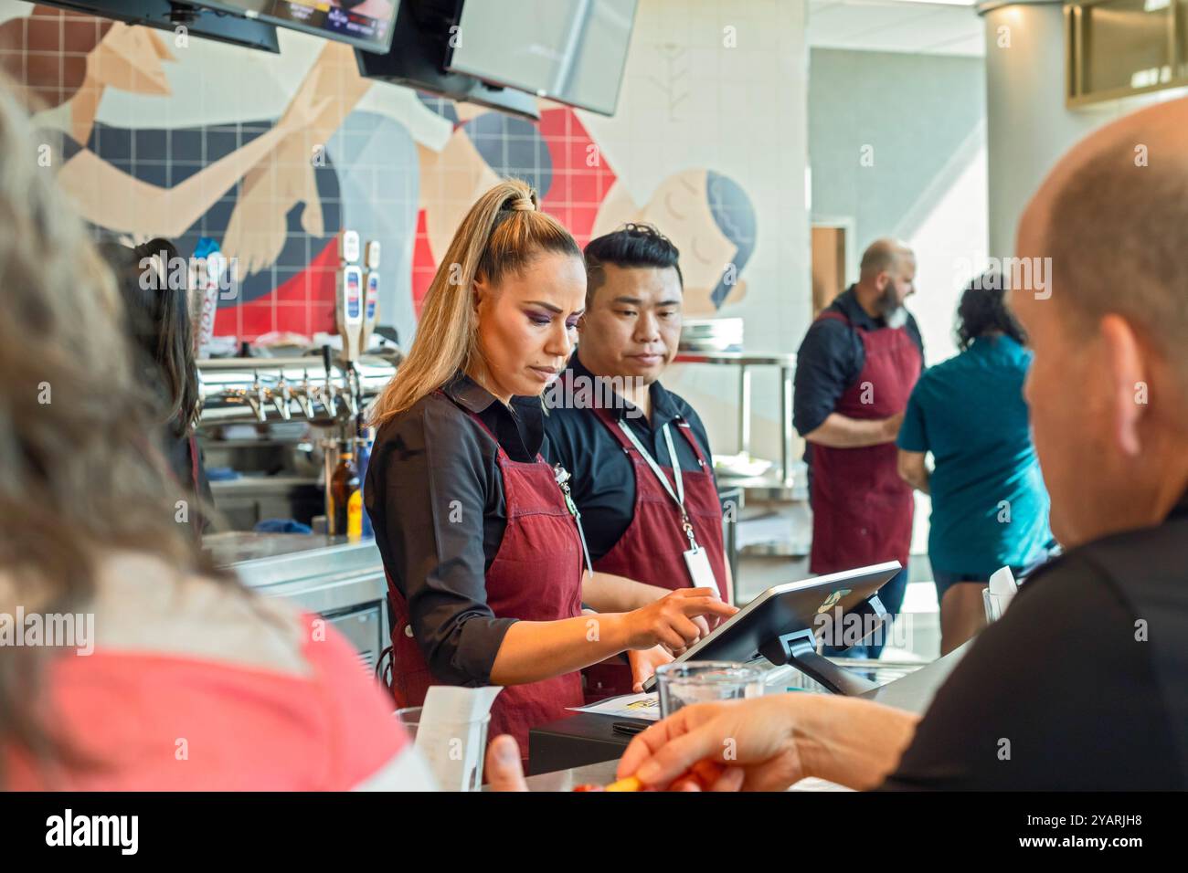 Denver, Colorado - Workers at Bar Dough, an airport restaurant and bar ...