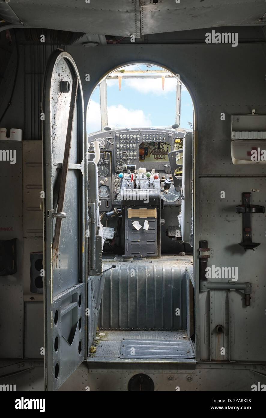 Interior of the cockpit with the broken dashboard of an abandoned small ...
