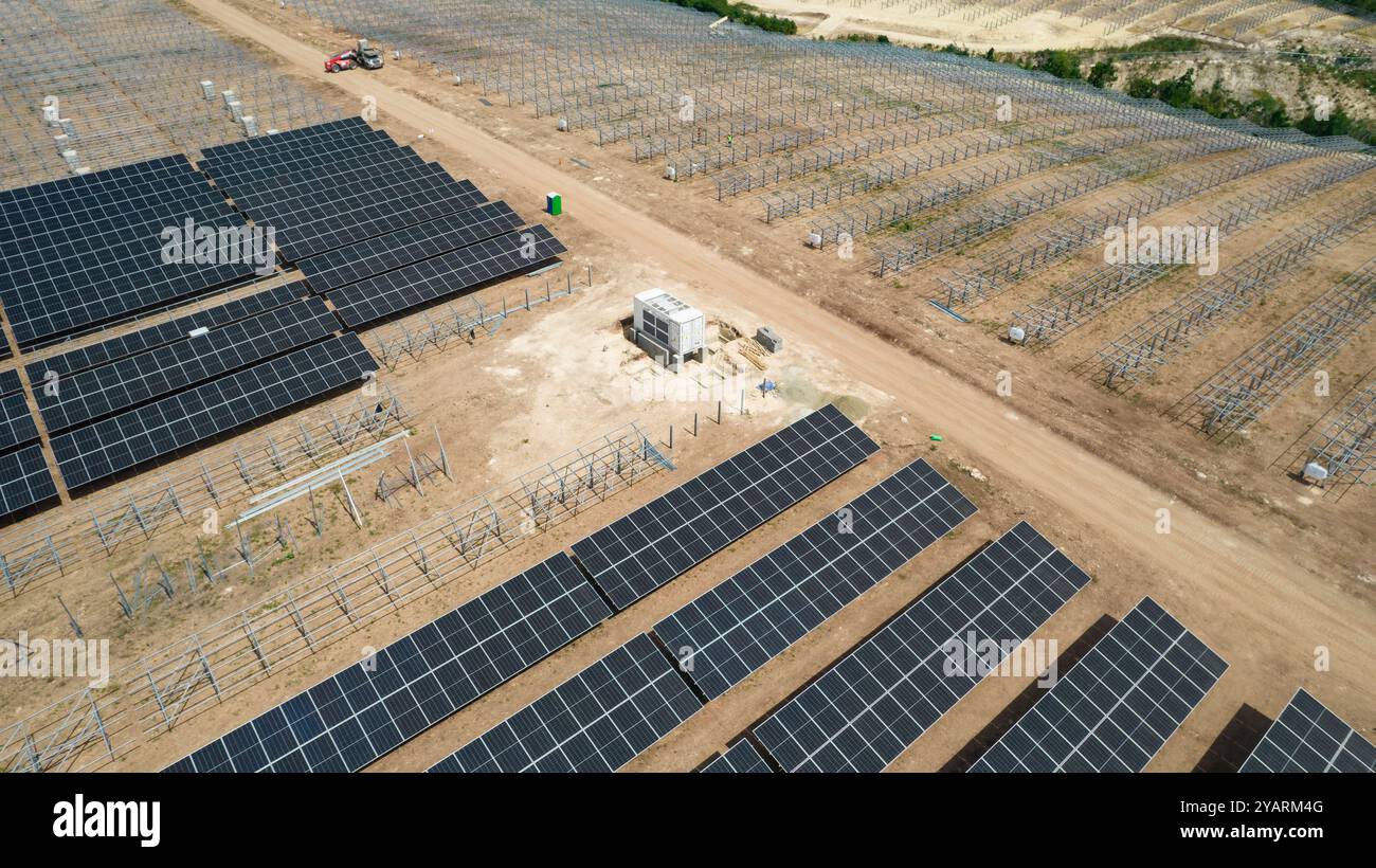 Drone picture of mens working in a modern utility scale solar farm ...