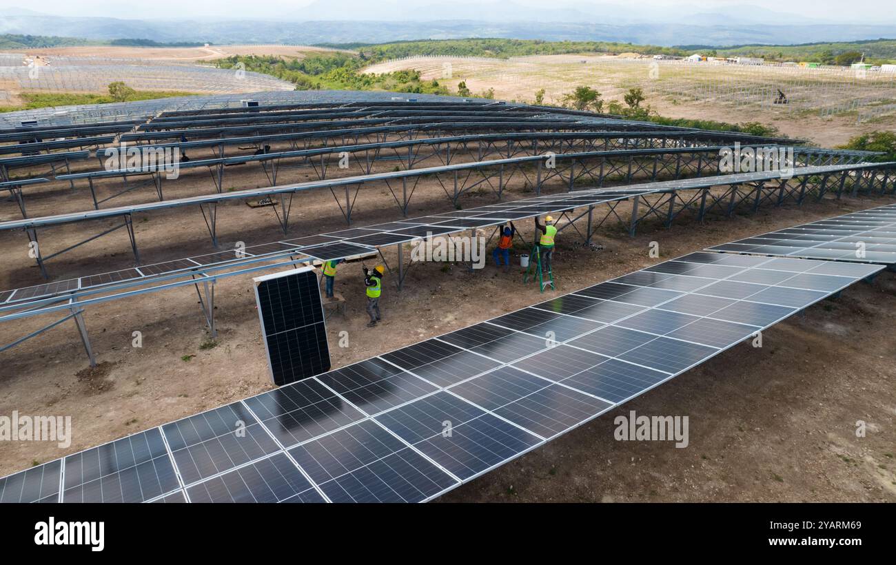 Drone picture of mens working in a modern utility scale solar farm ...