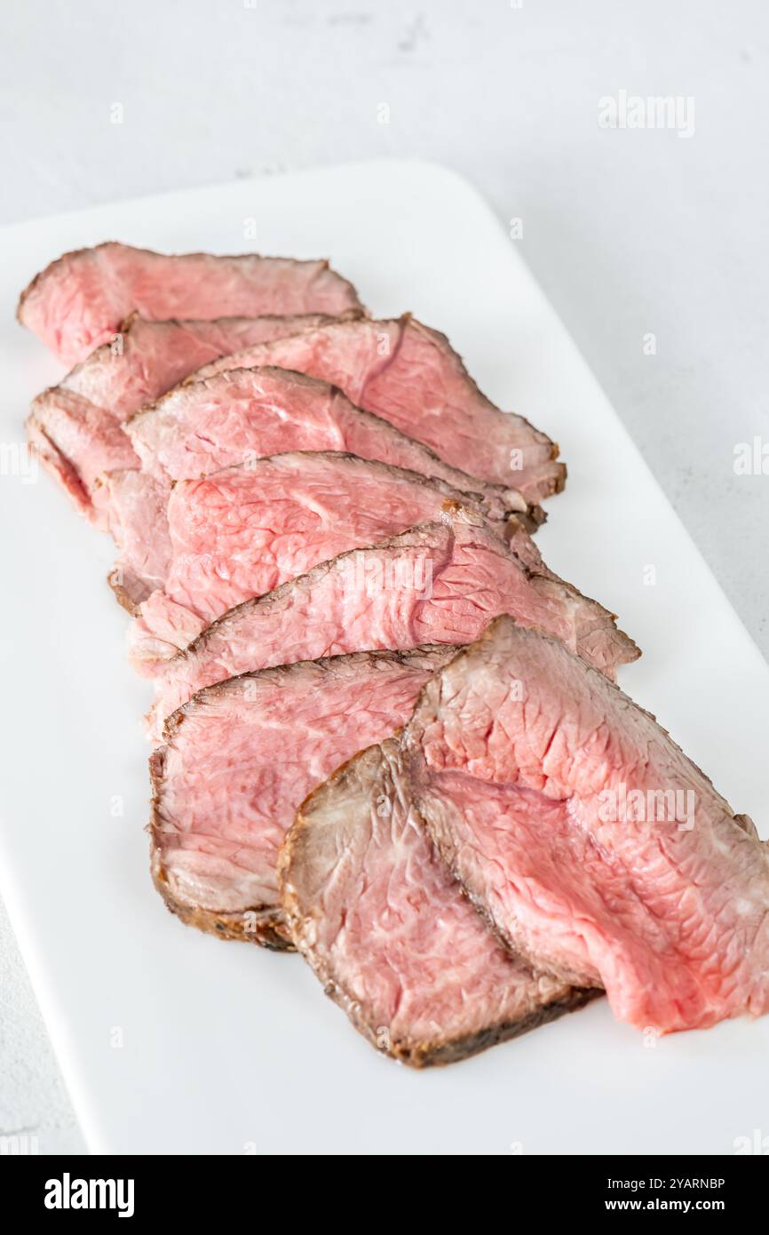 Portion of sliced roast beef on the plate Stock Photo - Alamy