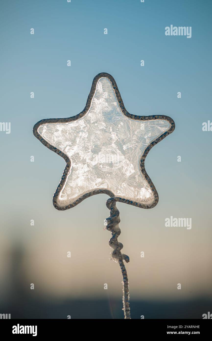concept winter, frost. beautiful frosty patterns on a star shape, soap ...