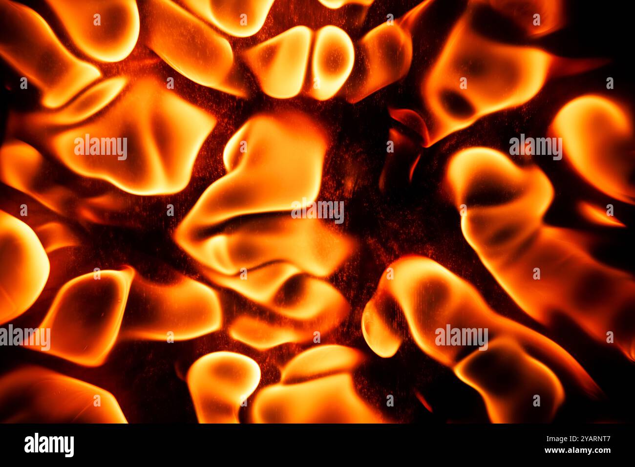 Beautiful liquid red, orange fire texture on black background. Fire in ...