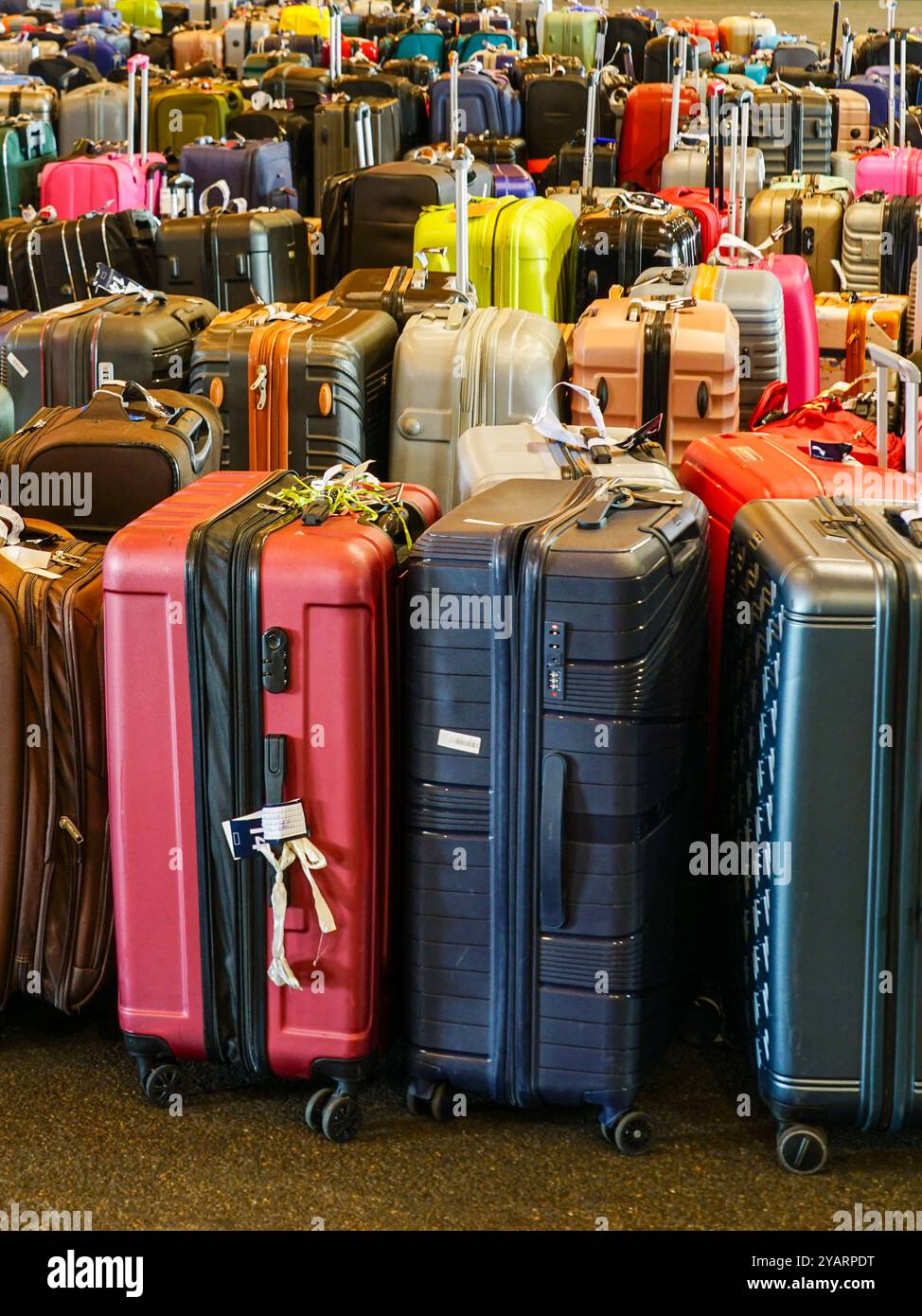 Many different sizes and colors variegated rolling travel suitcases in ...