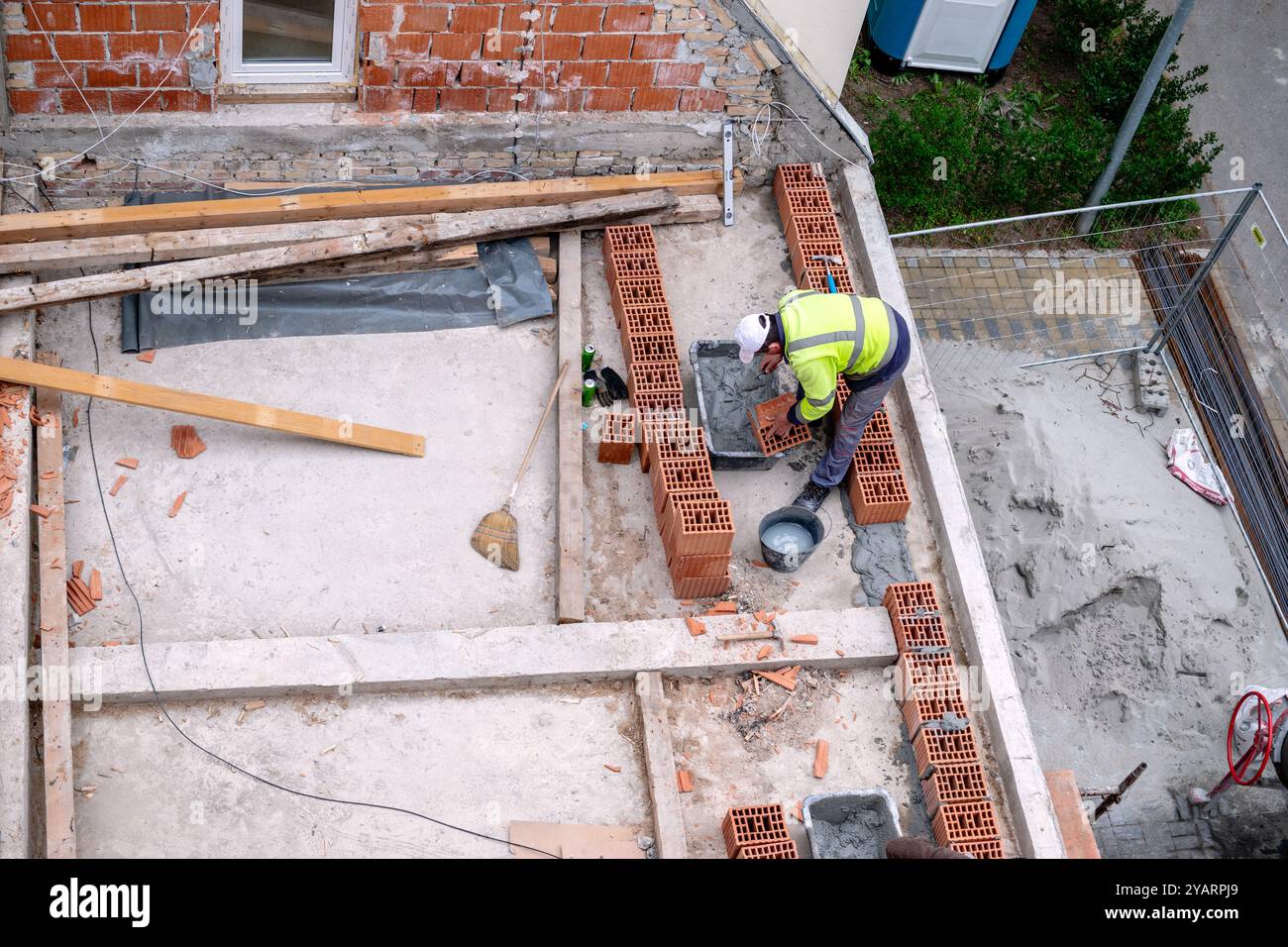 Construction worker prepare cement and mortar for building brick walls ...