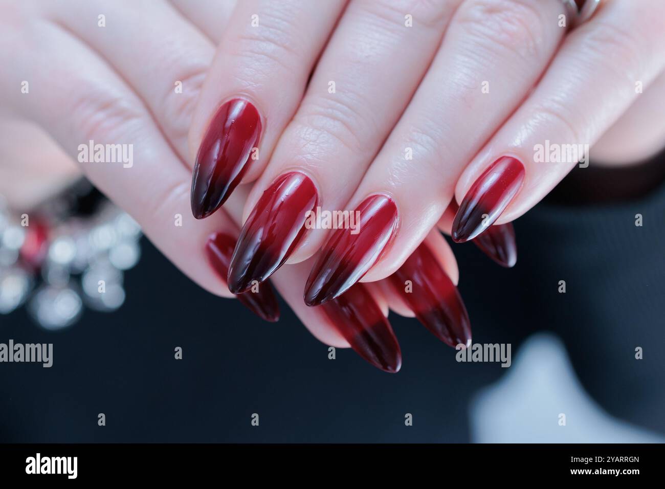 Female hand with long nails and a bright red manicure Stock Photo - Alamy