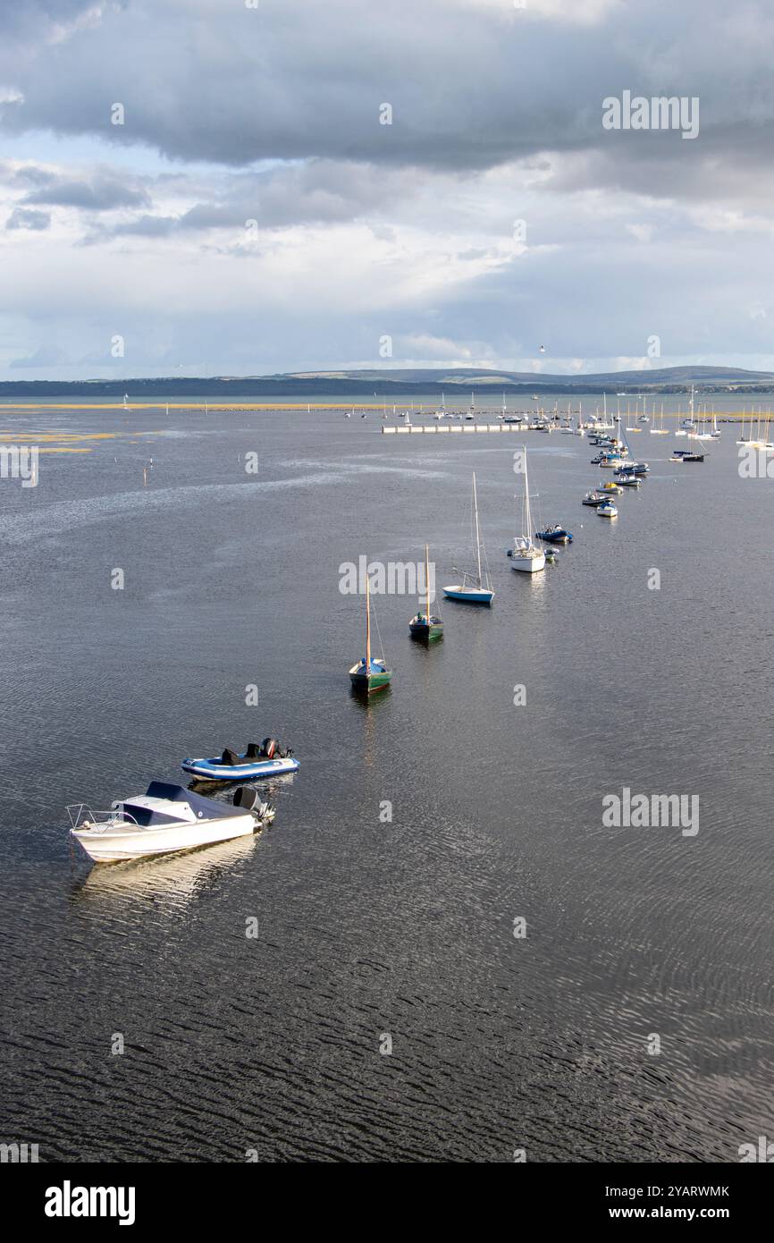 Lymington River - yachts on moorings with sea and sky Stock Photo - Alamy