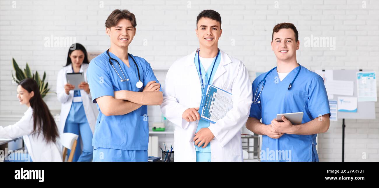 Male doctors working in clinic. Cancer awareness concept Stock Photo ...