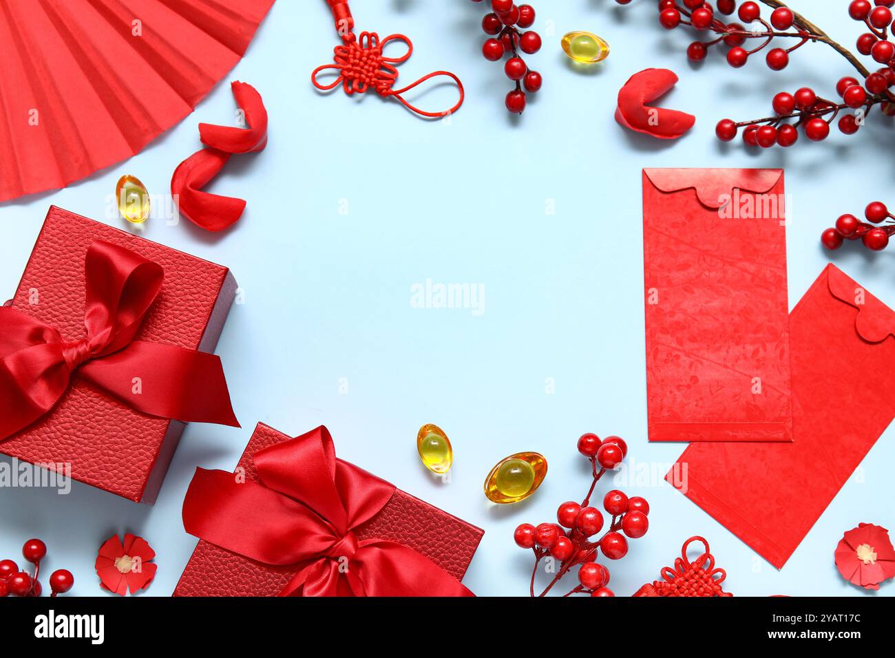 Frame made of gift boxes, fortune cookies and Chinese symbols on blue ...