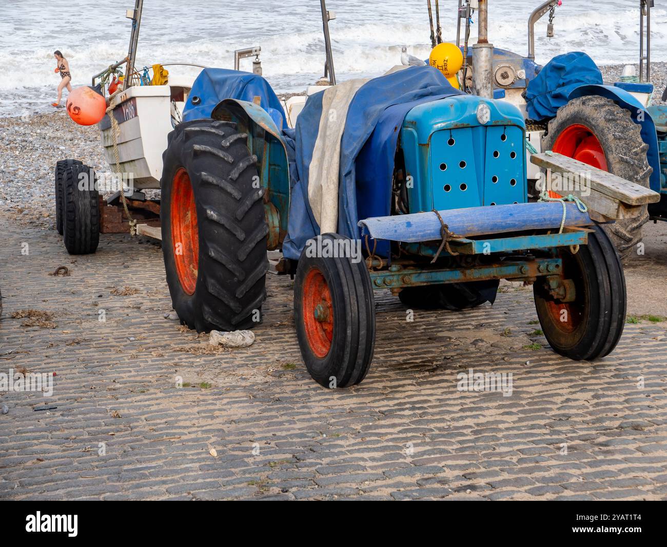 Tractors and fishing boats on Cromer pier, Norfolk coast Stock Photo ...