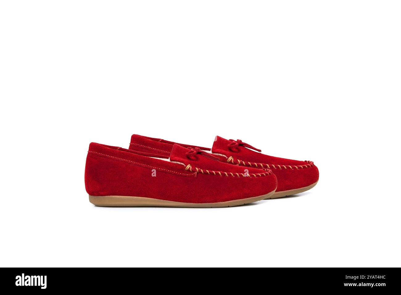 A pair of red suede loafers on a white background with copy space Stock ...