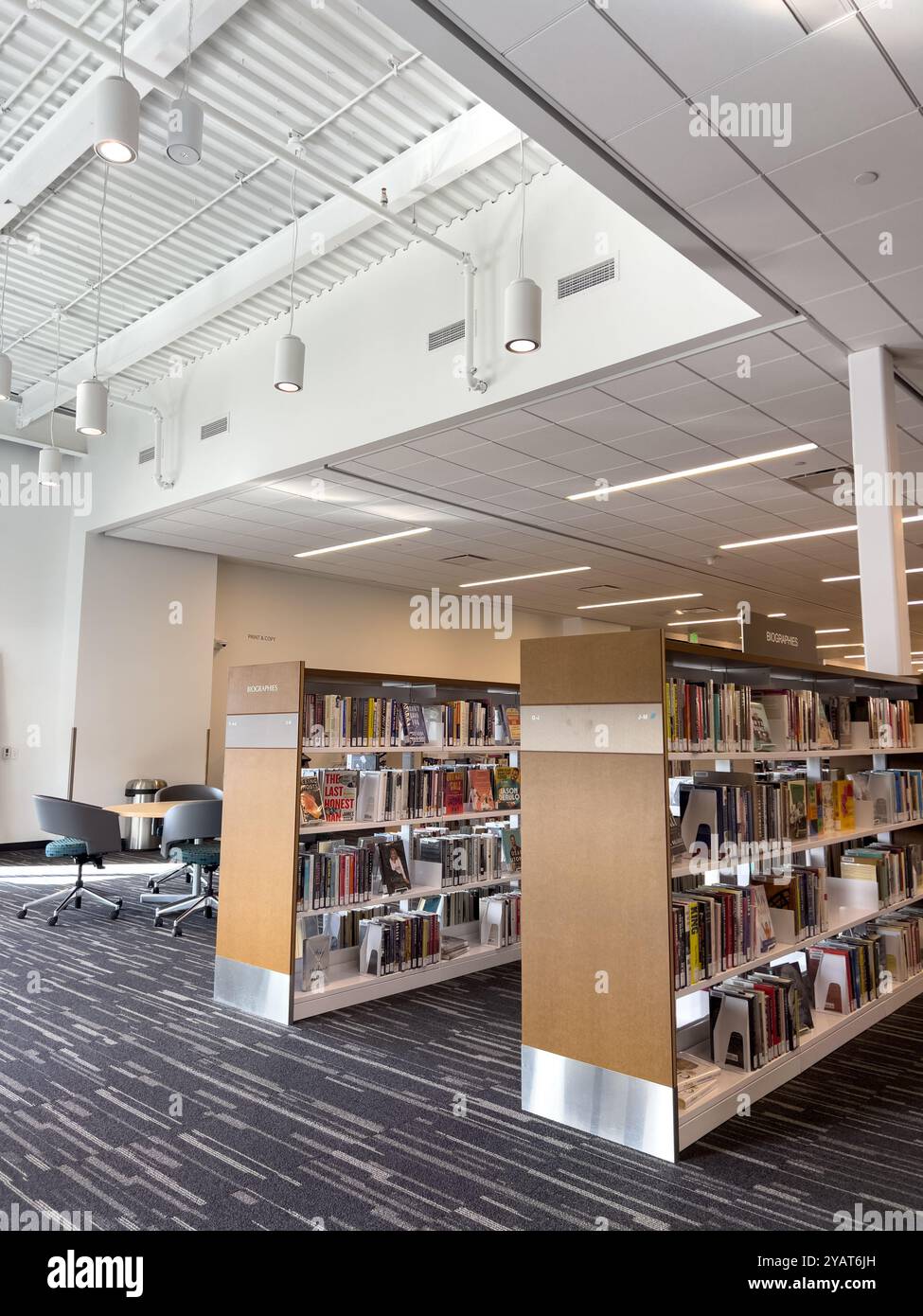 Modern Library Interior with Organized Bookshelves and Reading Area ...