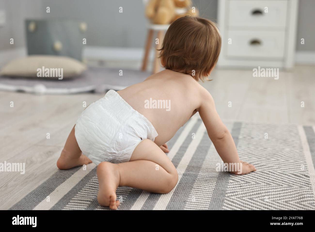 Cute little child in diaper at home Stock Photo - Alamy