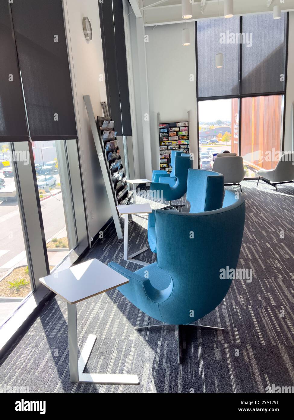 Modern Library Lounge with Bright Orange Chairs and Glass-Enclosed ...