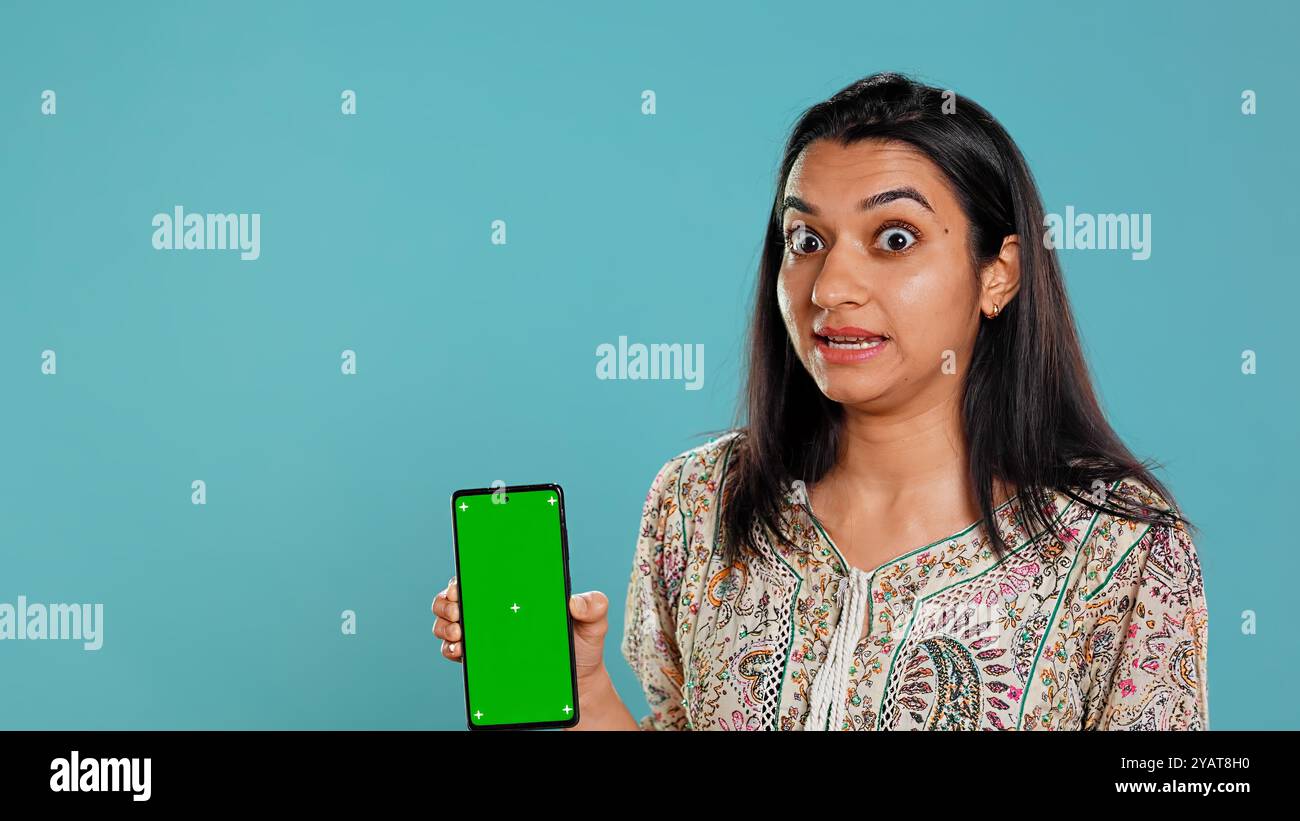 Tech content creator doing influencer marketing using green screen ...