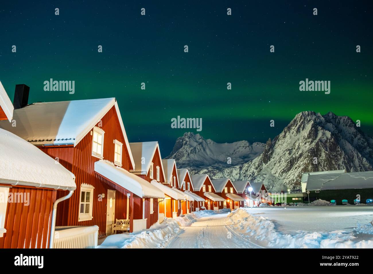 Northern lights over rorbu cabins in Svolvaer on Lofoten islands ...