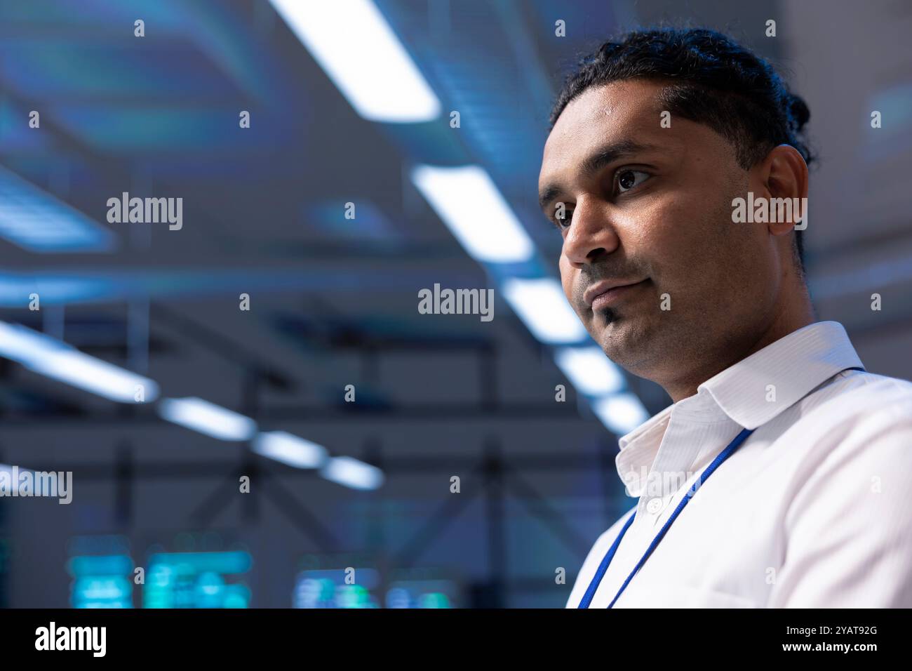 Engineer walking through server racks hi-res stock photography and ...