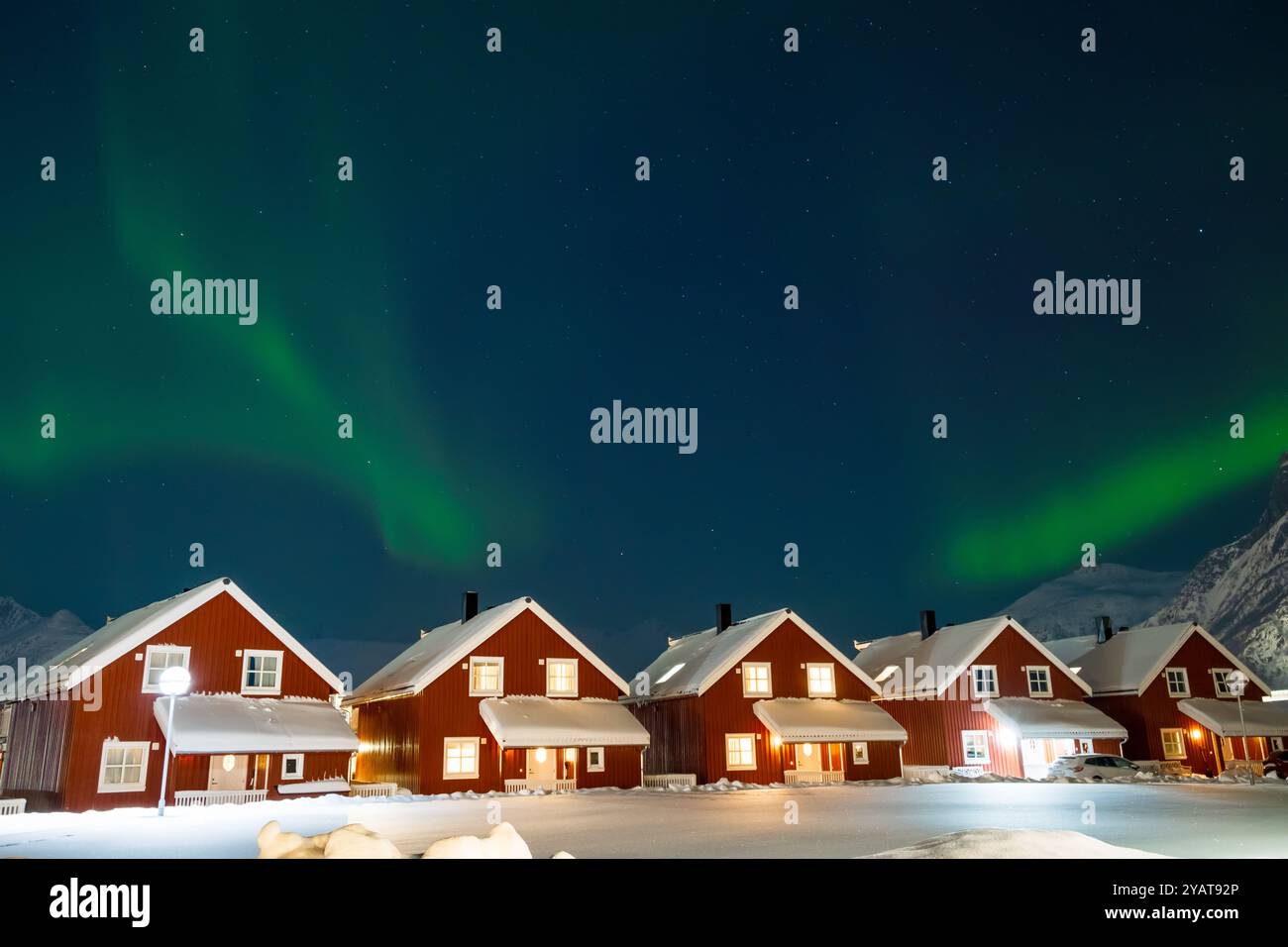 Northern lights over rorbu cabins in Svolvaer on Lofoten islands ...