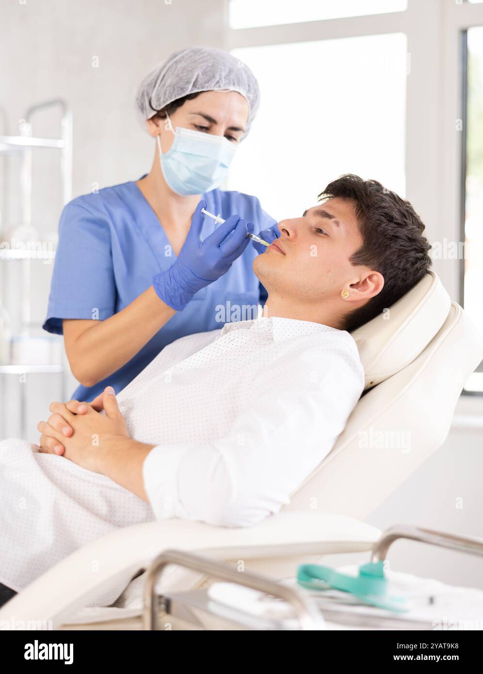 Facial injection male patient Stock Photo - Alamy