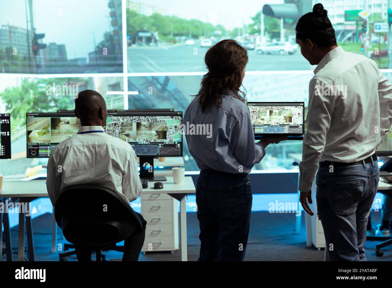 Agency employees operating on satellite map of the city to send gps ...