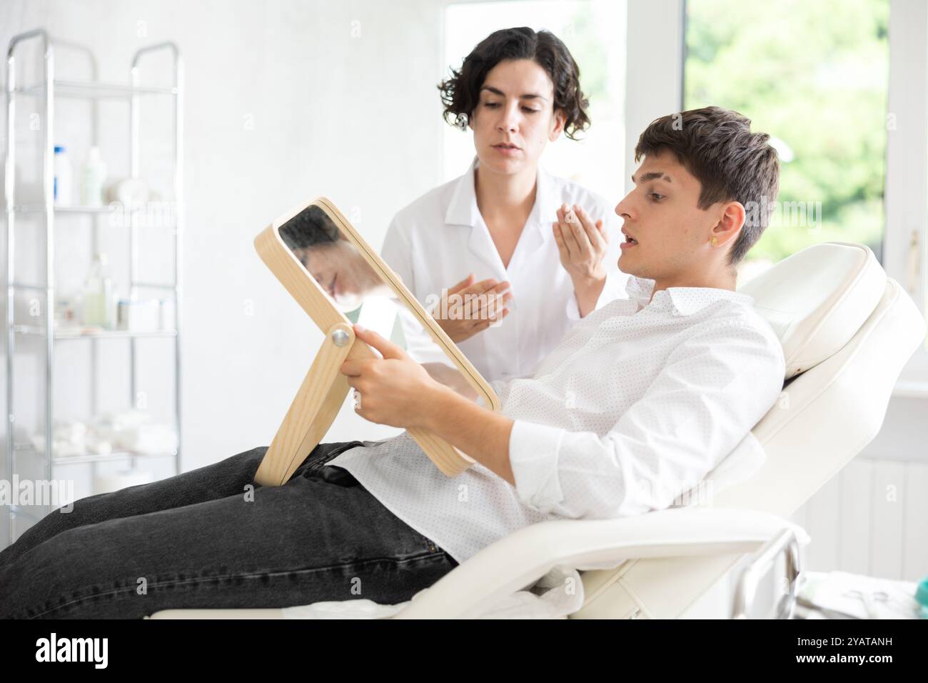 male patient with mirror Stock Photo - Alamy
