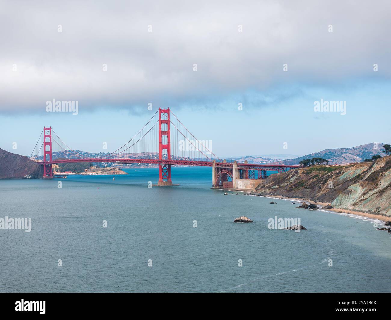Golden Gate Bridge Spanning San Francisco Bay Under Partly Cloudy Sky ...
