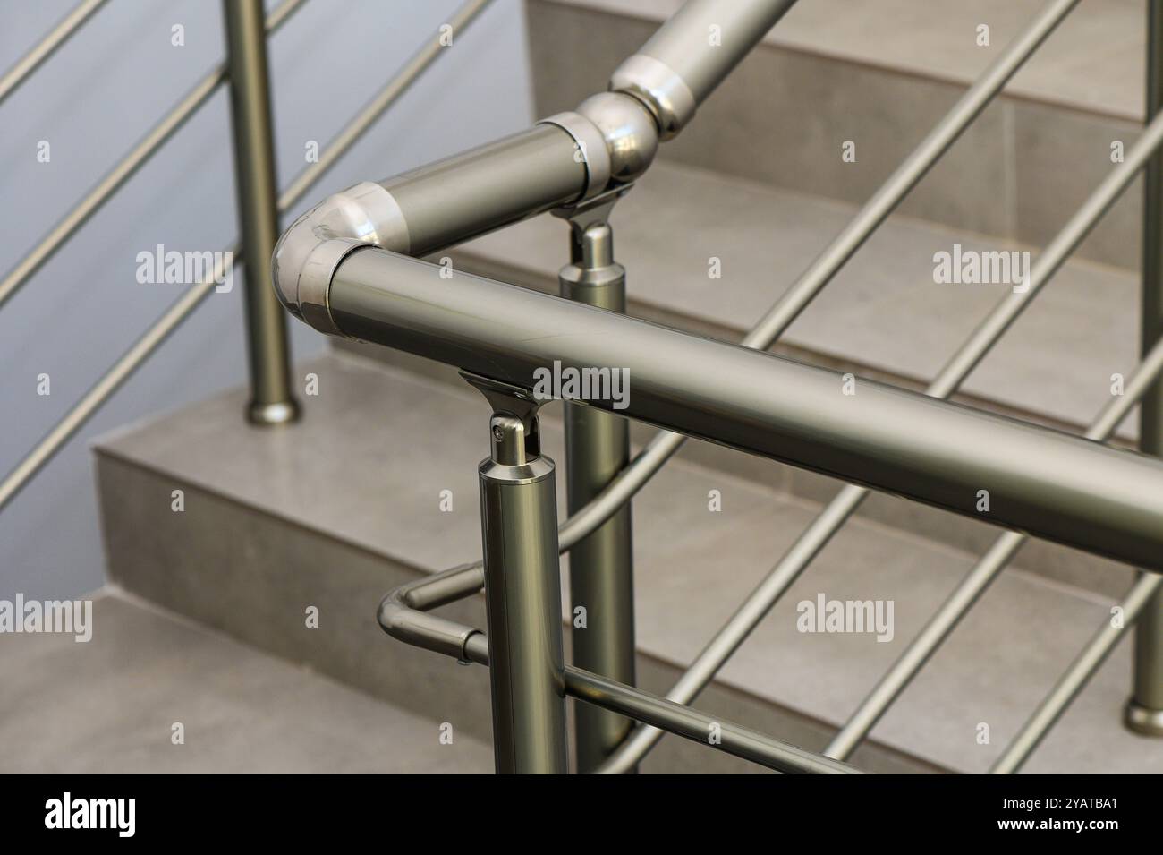 This elegant metal railing complements a chic staircase, featuring a ...