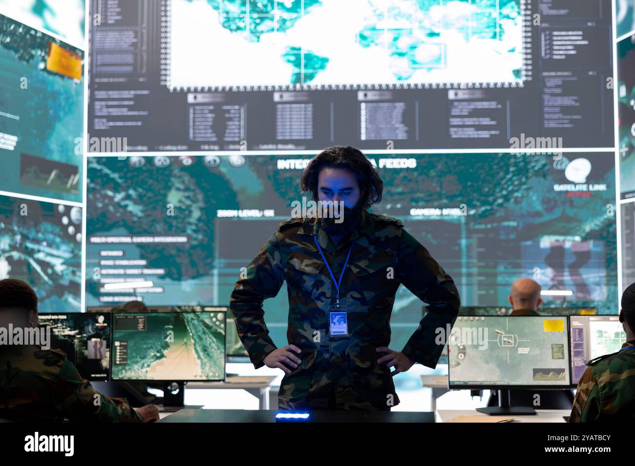 Special operations engineer reviewing battlefield data on a hologram, working with high tech ...