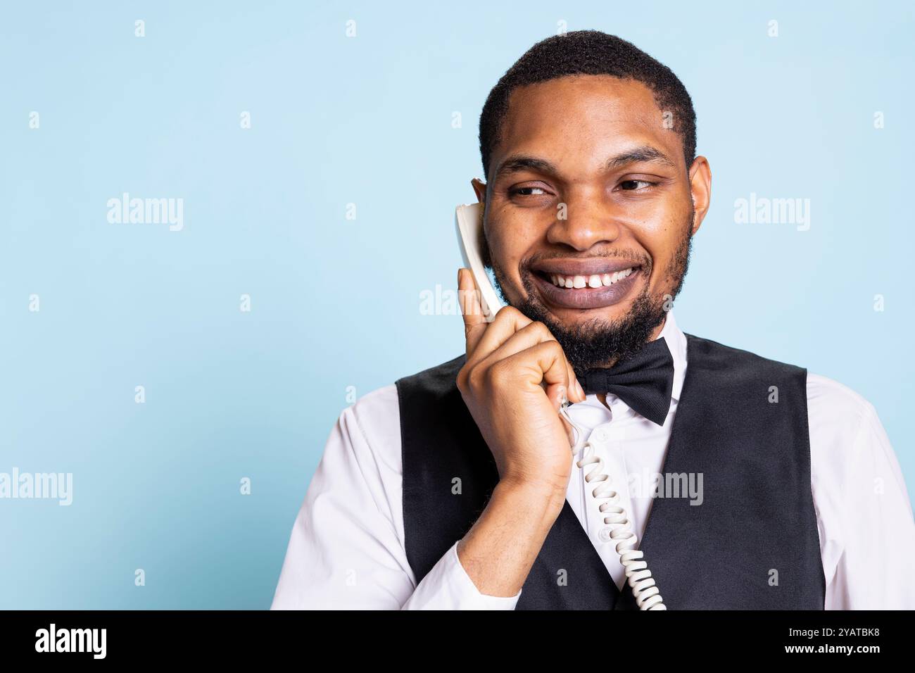 Hospitality industry staff gives lodging information to people on ...