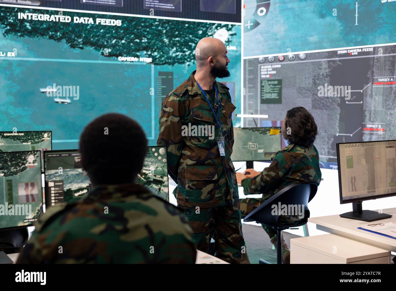 Trooper in camouflage uniform supervising surveillance systems in ...