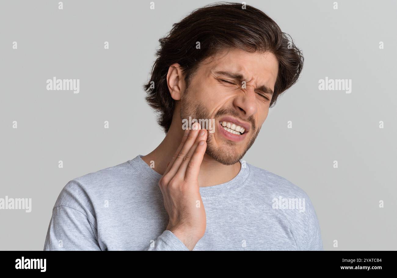 Dental problems concept. Man suffering from toothache Stock Photo - Alamy
