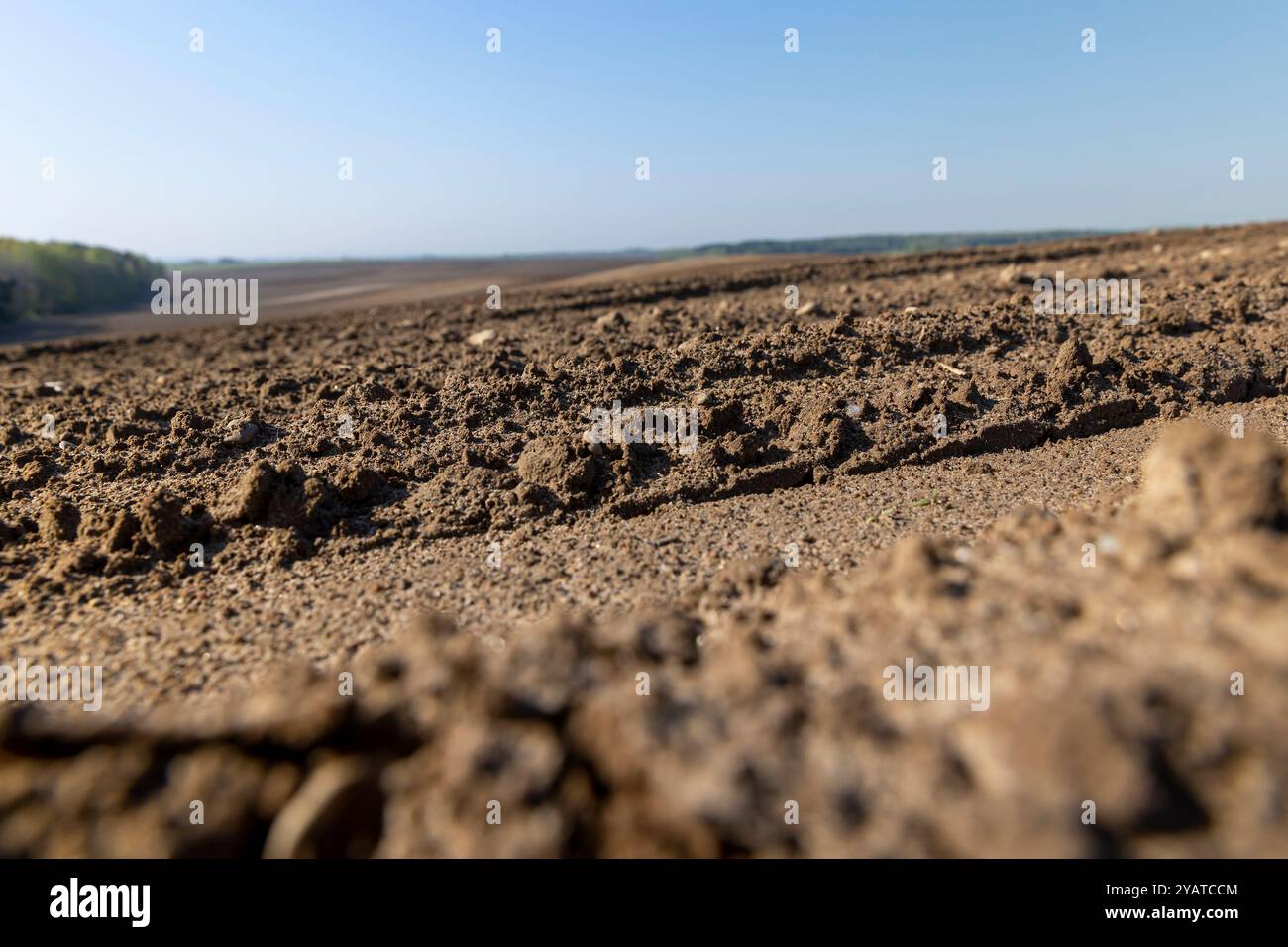 soil for sowing plants with traces of a tractor, fertile soil in spring ...