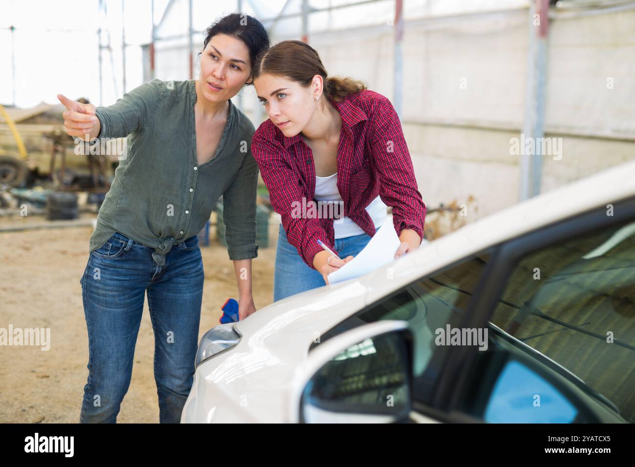 Woman and girl talking about documentation Stock Photo - Alamy