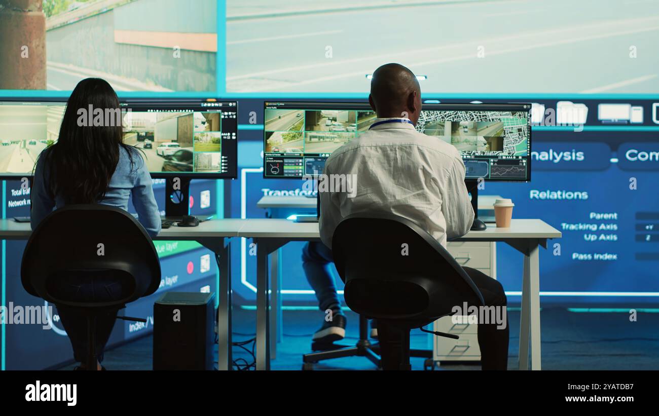 Diverse employees monitoring urban hi-res stock photography and images ...
