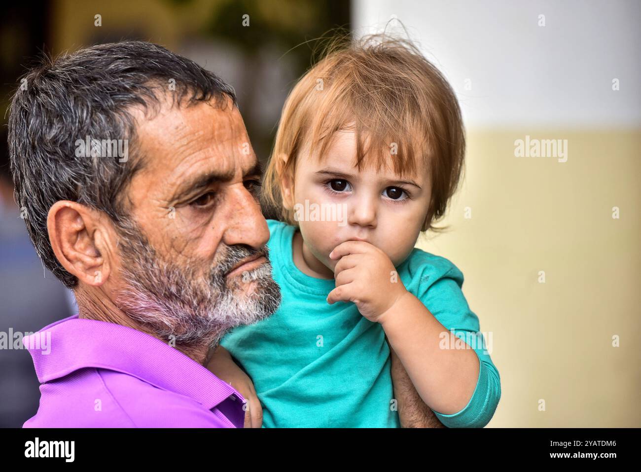 Displaced Lebanese man with his son at the Omar Farroukh public school ...