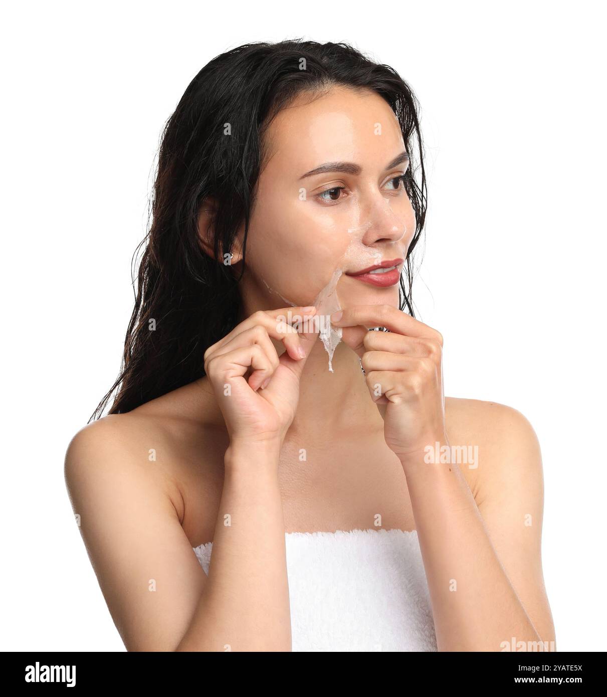 Beautiful woman peeling off face mask on white background Stock Photo ...