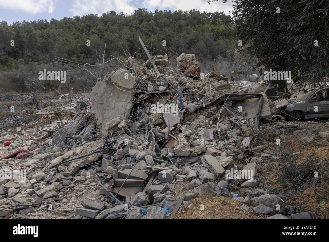 October 15, 2024, Aitou, Lebanon: Tangled rebar and concrete are piled ...