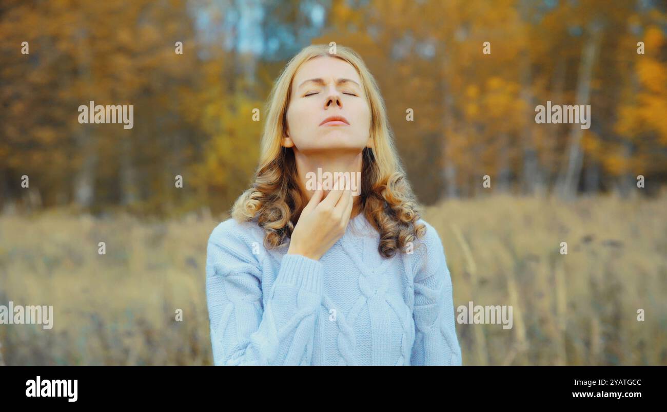 Sick exhausted young woman suffering from acute sore in throat flu ...