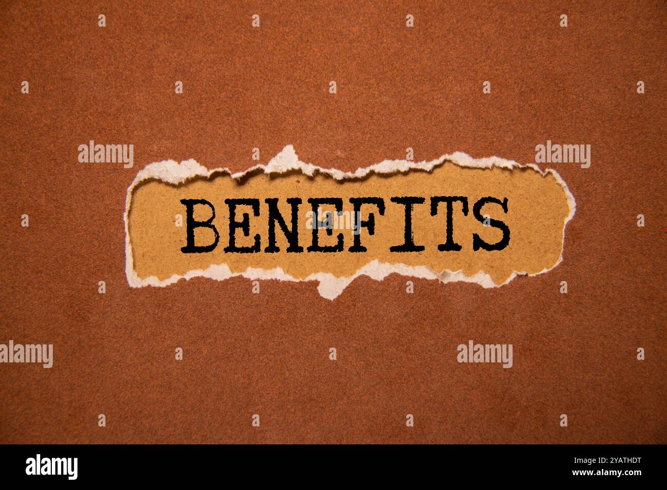 text of BENEFITS on the plain card inside the brown envelop on the pink ...