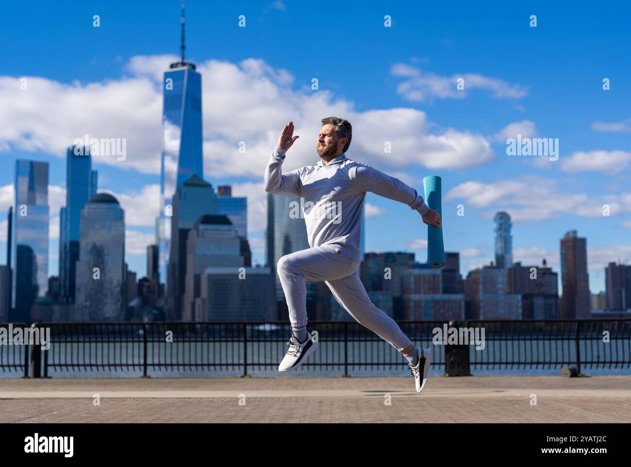 Man runner training in Manhattan. Sport athlete man running in New York ...