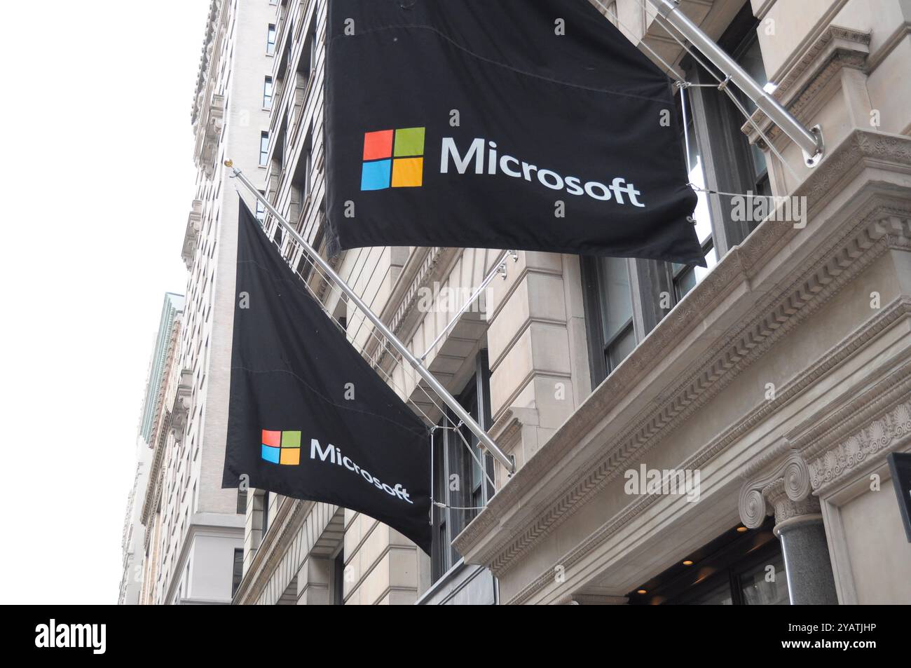 Flags with the Microsoft logo are seen at a Microsoft office in ...