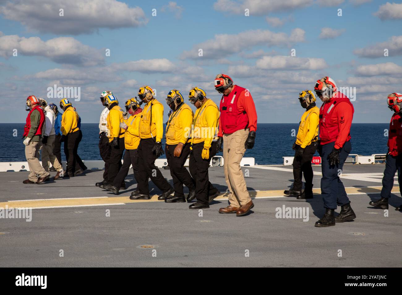 Sailors assigned to the Wasp-class amphibious assault ship USS Iwo Jima ...