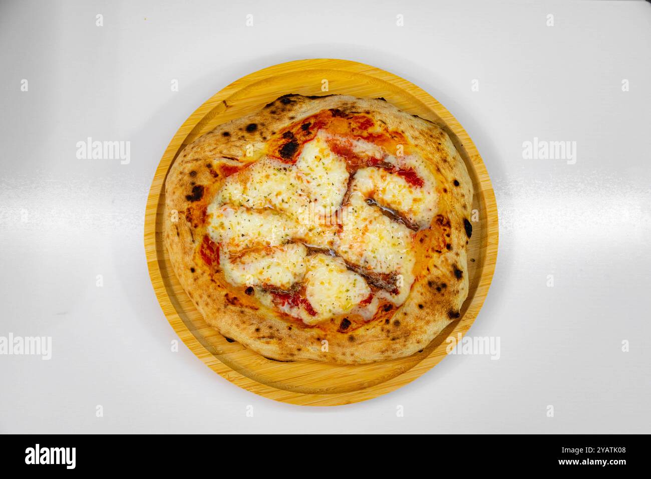 Classic rustic artisanal pizza with long-maturing dough Stock Photo - Alamy