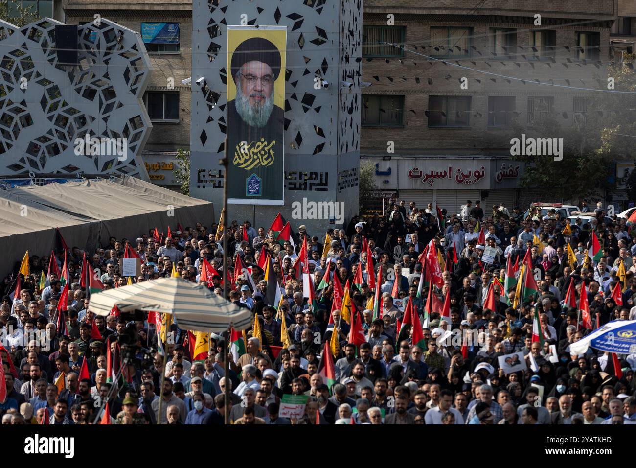 People attend the funeral ceremony of the late Iranian Revolutionary ...