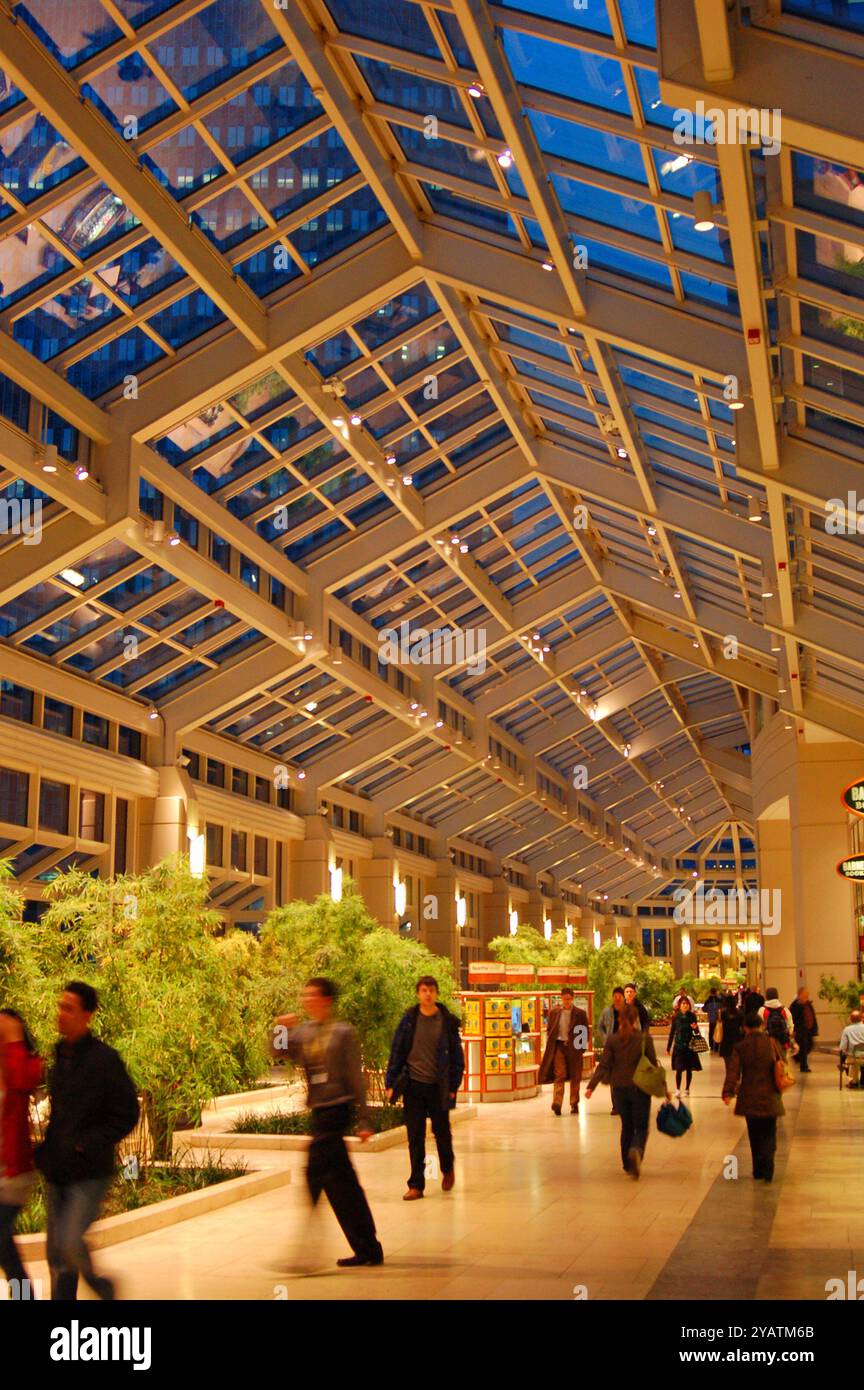 Shoppers walk under a glass atrium at the Copley Square Mall in Boston ...