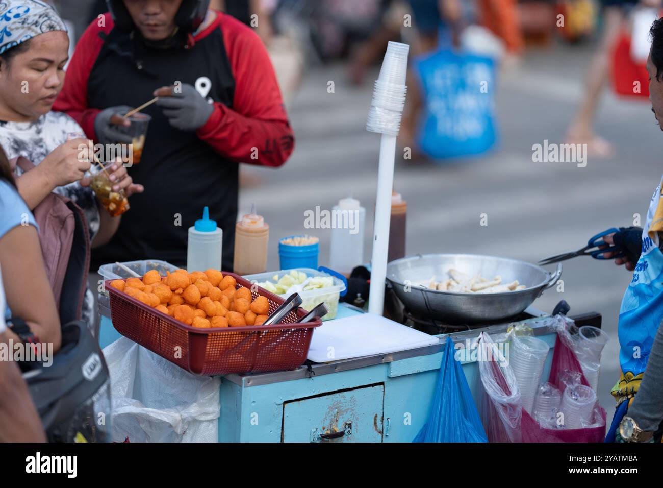 12/10/2024 Cebu City, Philippines A street food stall where the vendor ...