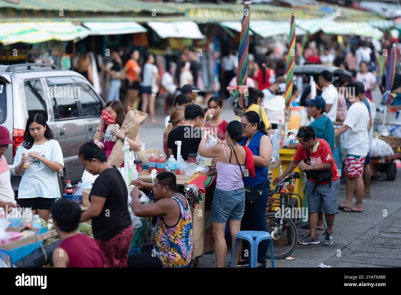 12/10/2024 Cebu City, Philippines.A line of street food vendors selling ...