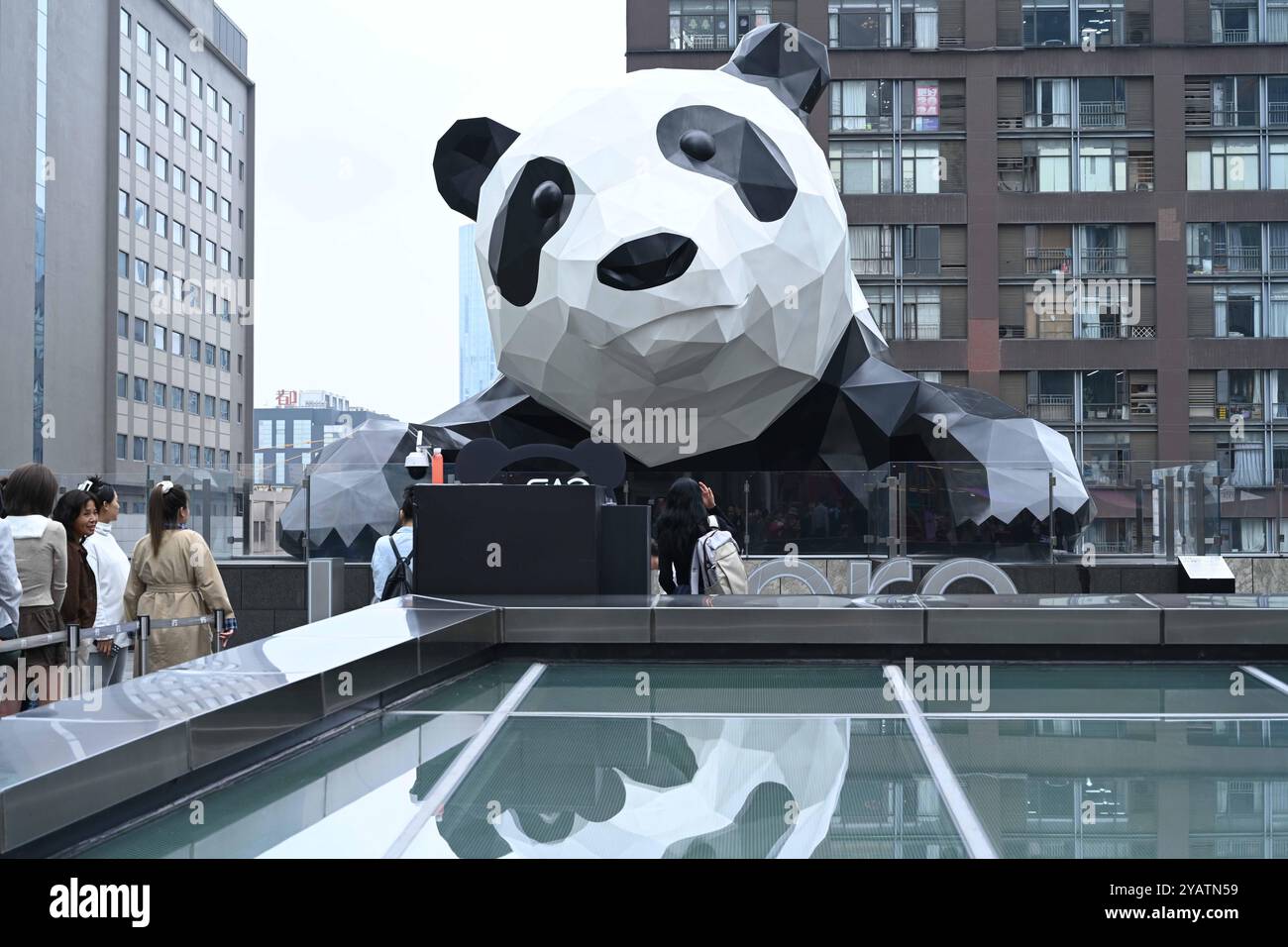 CHENGDU, CHINA - OCTOBER 15, 2024 - People line up to take a photo with ...