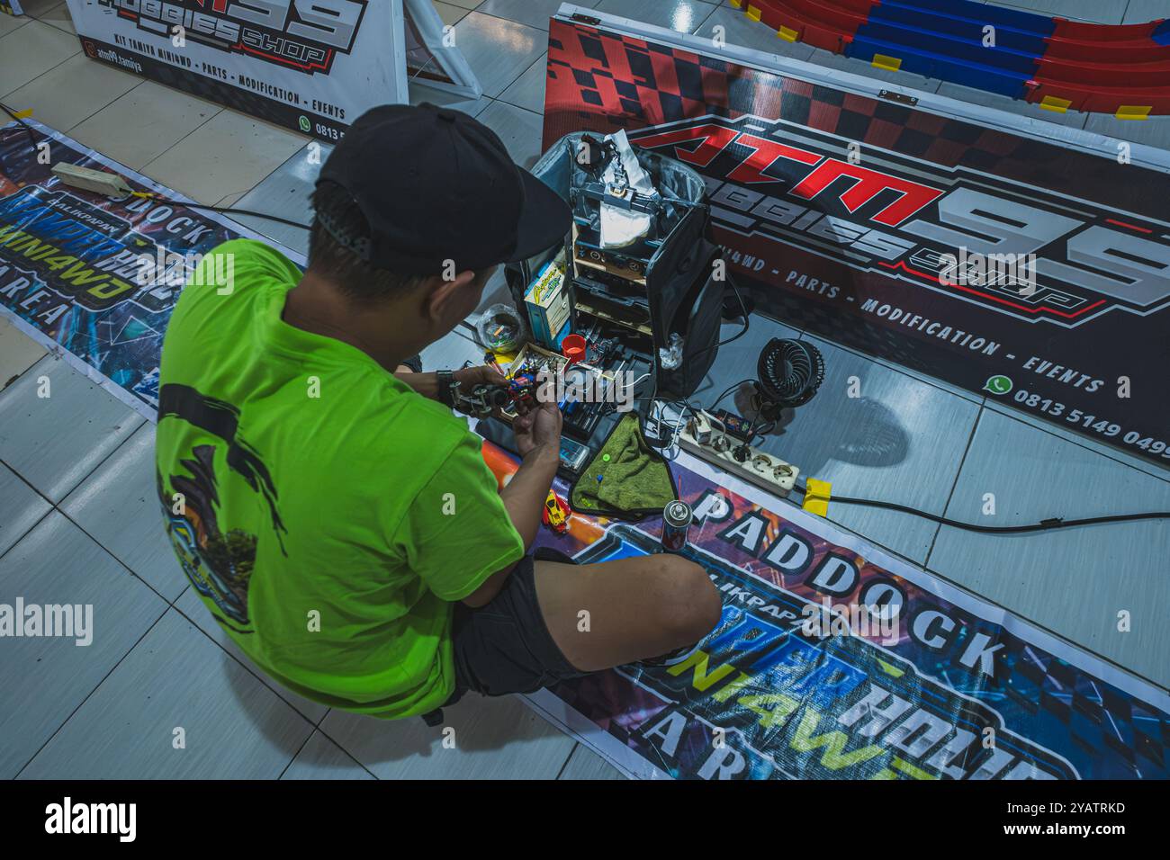 Balikpapan, Indonesia - August 10th, 2024. He is focusing on his Mini ...